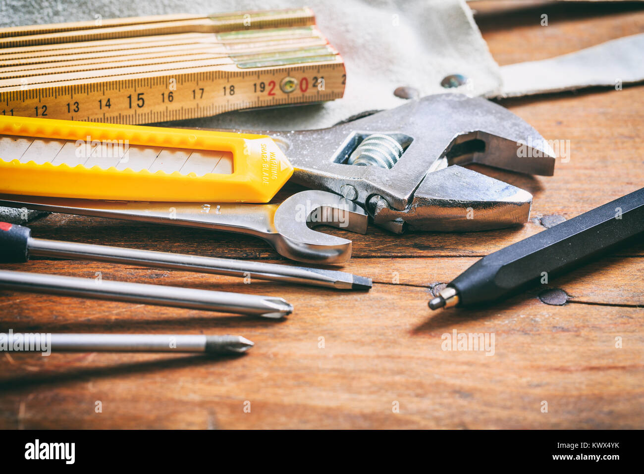 Set of hand tools on a wooden surface Stock Photo - Alamy