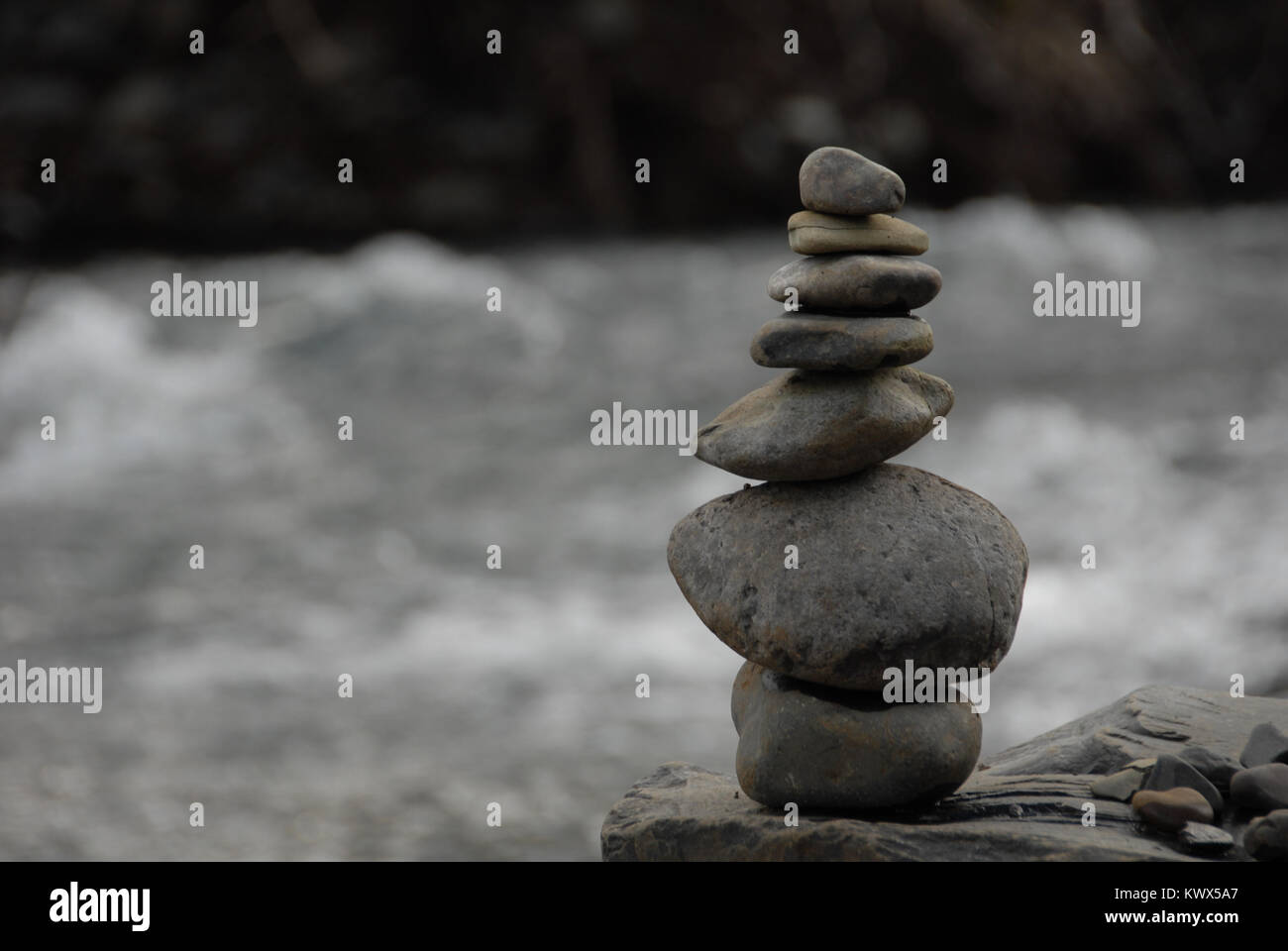 Zen rocks by rushing water Stock Photo - Alamy