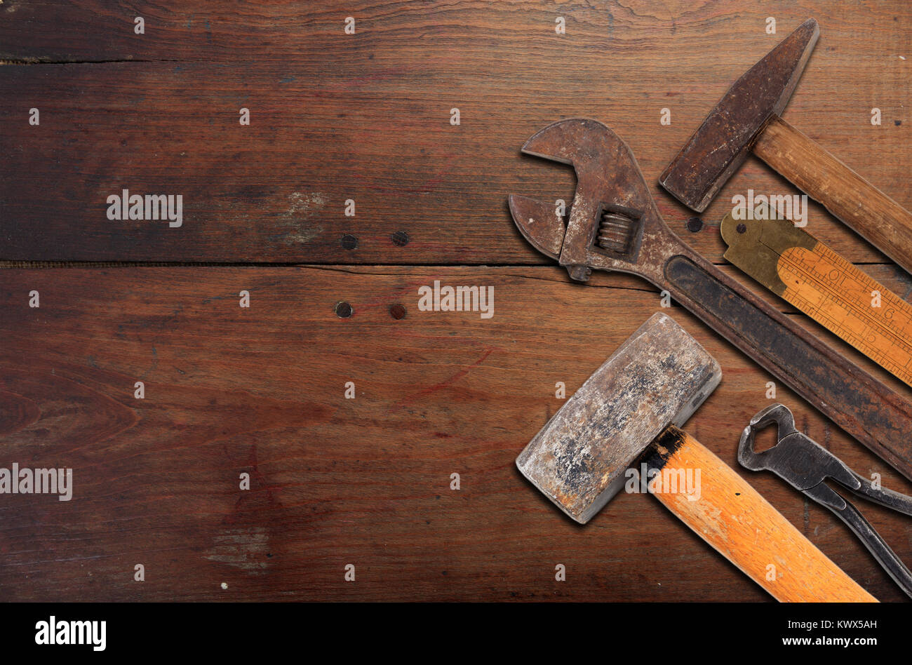 Set of old hand tools on wooden background Stock Photo - Alamy