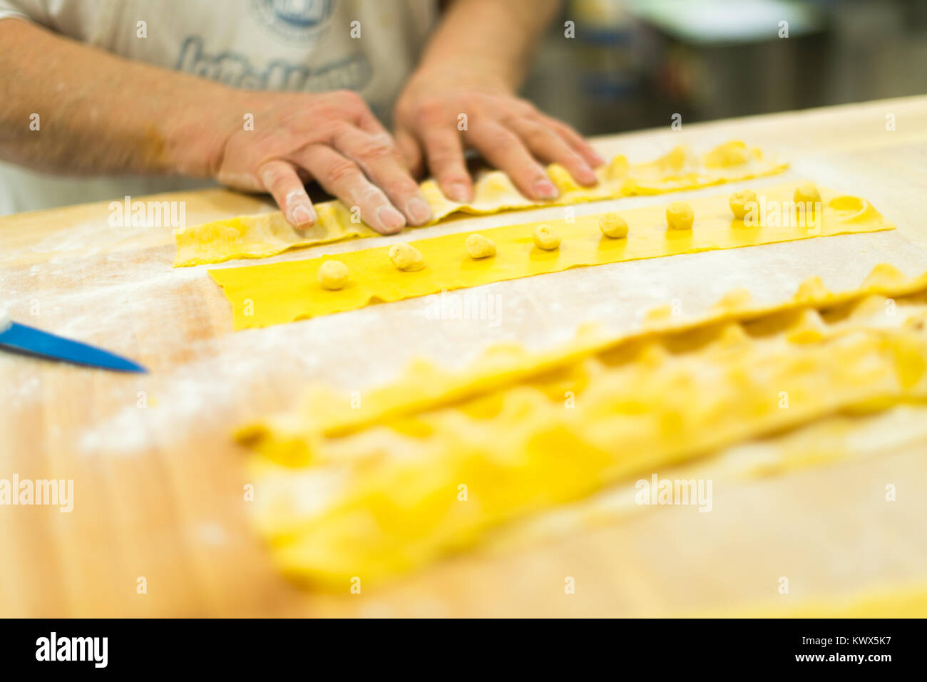Wrinkled hands making pasta hi-res stock photography and images - Alamy
