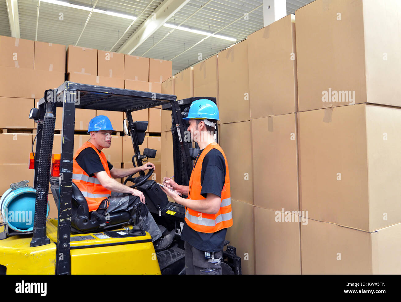 teamwork in logistics - group of workers in a department store with ...