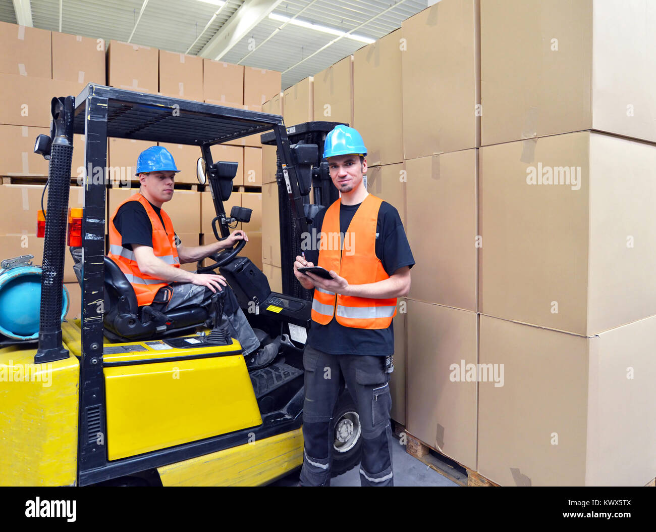 teamwork in logistics - group of workers in a department store with ...