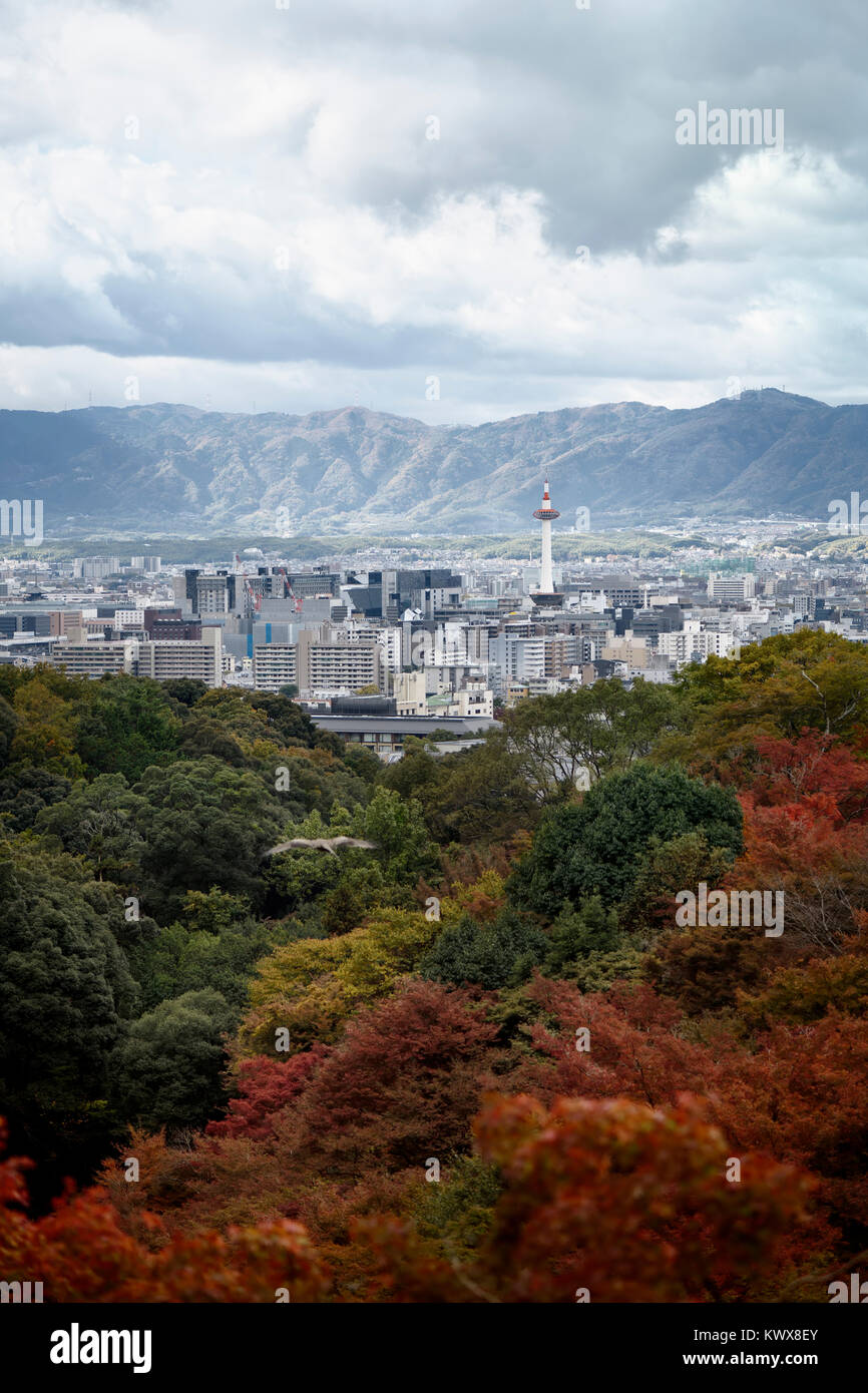 Kyoto tower and the cityscape with mountains in the background and ...