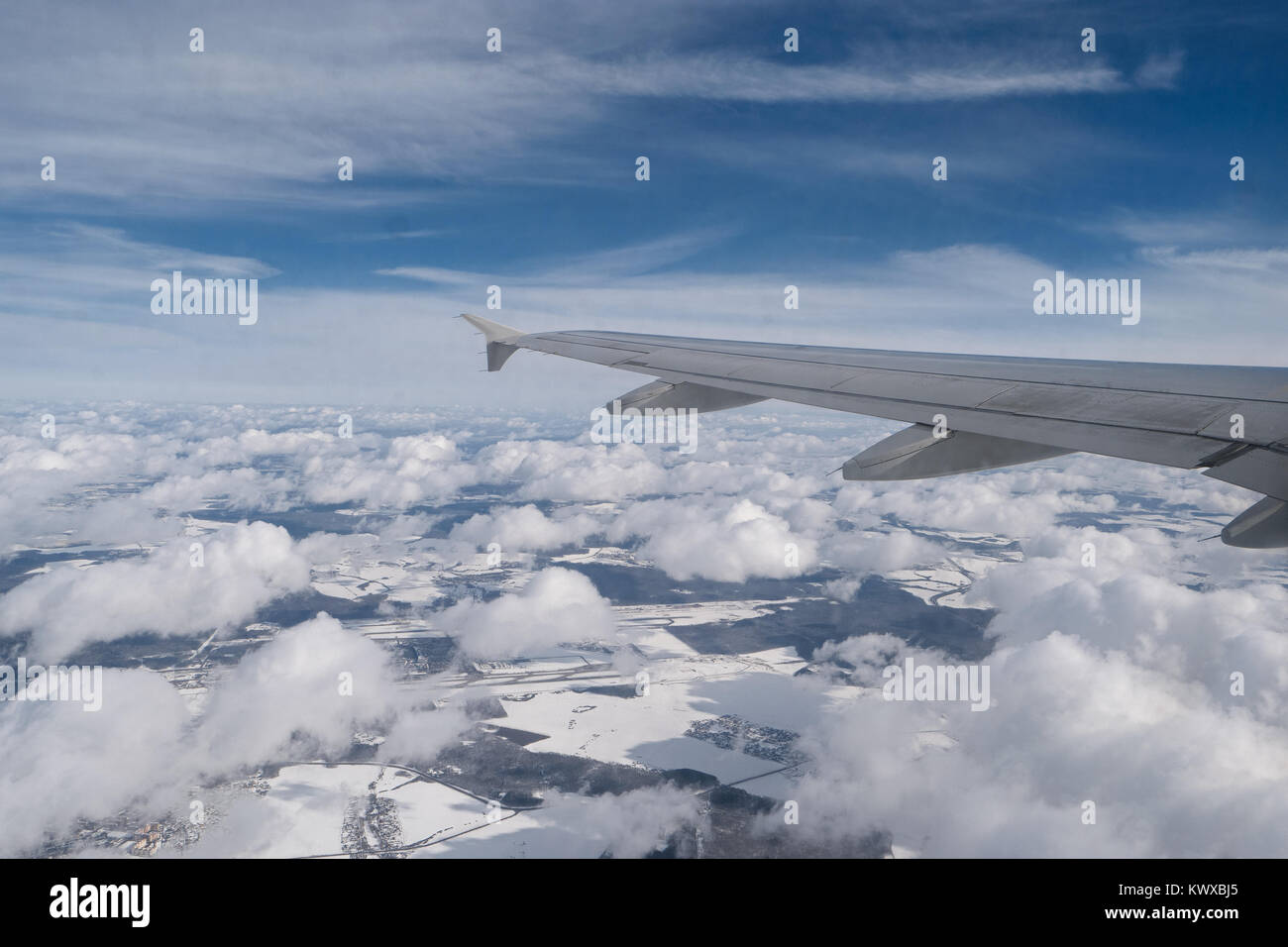 Jet beneath clouds hi-res stock photography and images - Alamy