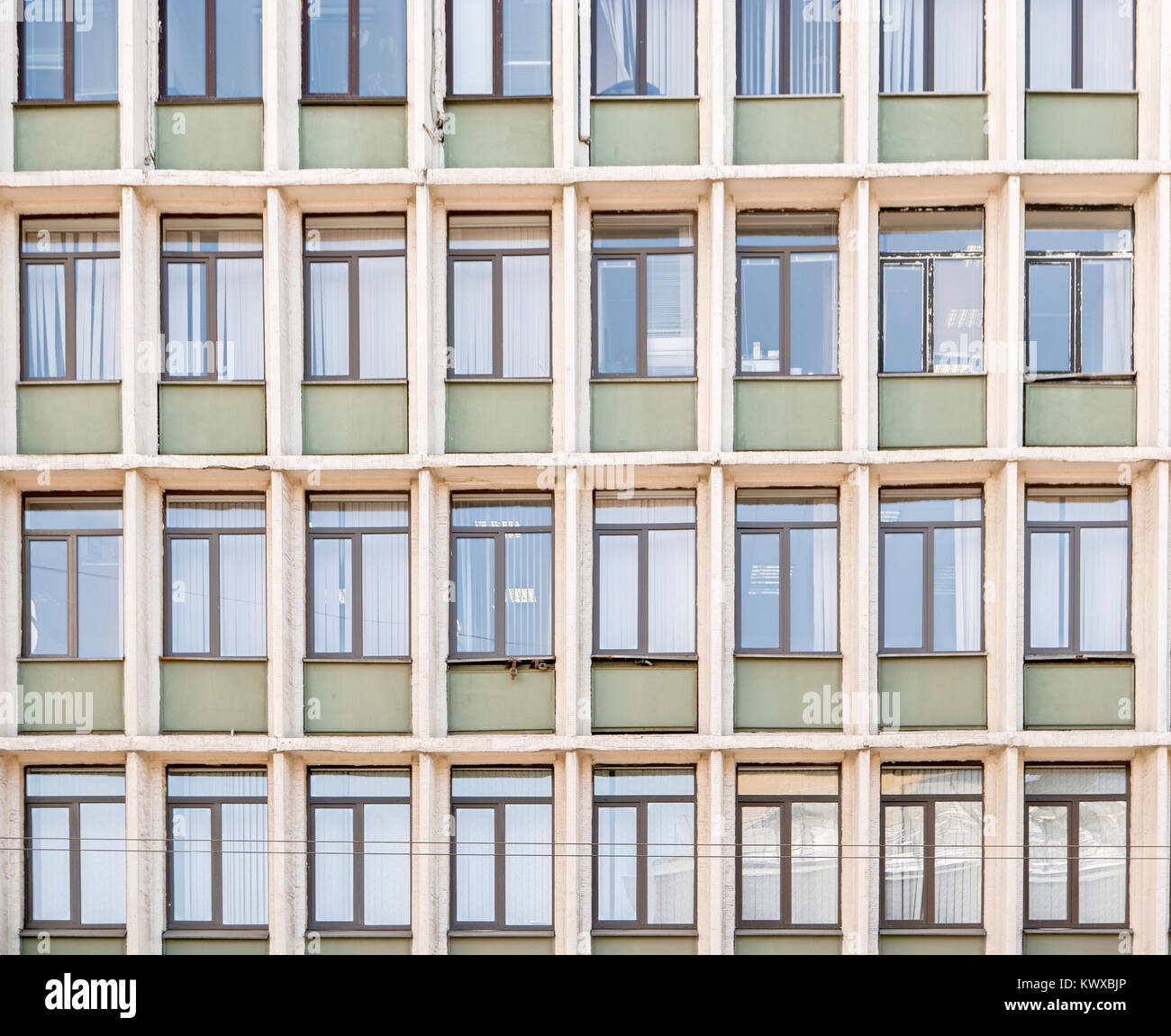 Hospital building covered with windows background Stock Photo - Alamy