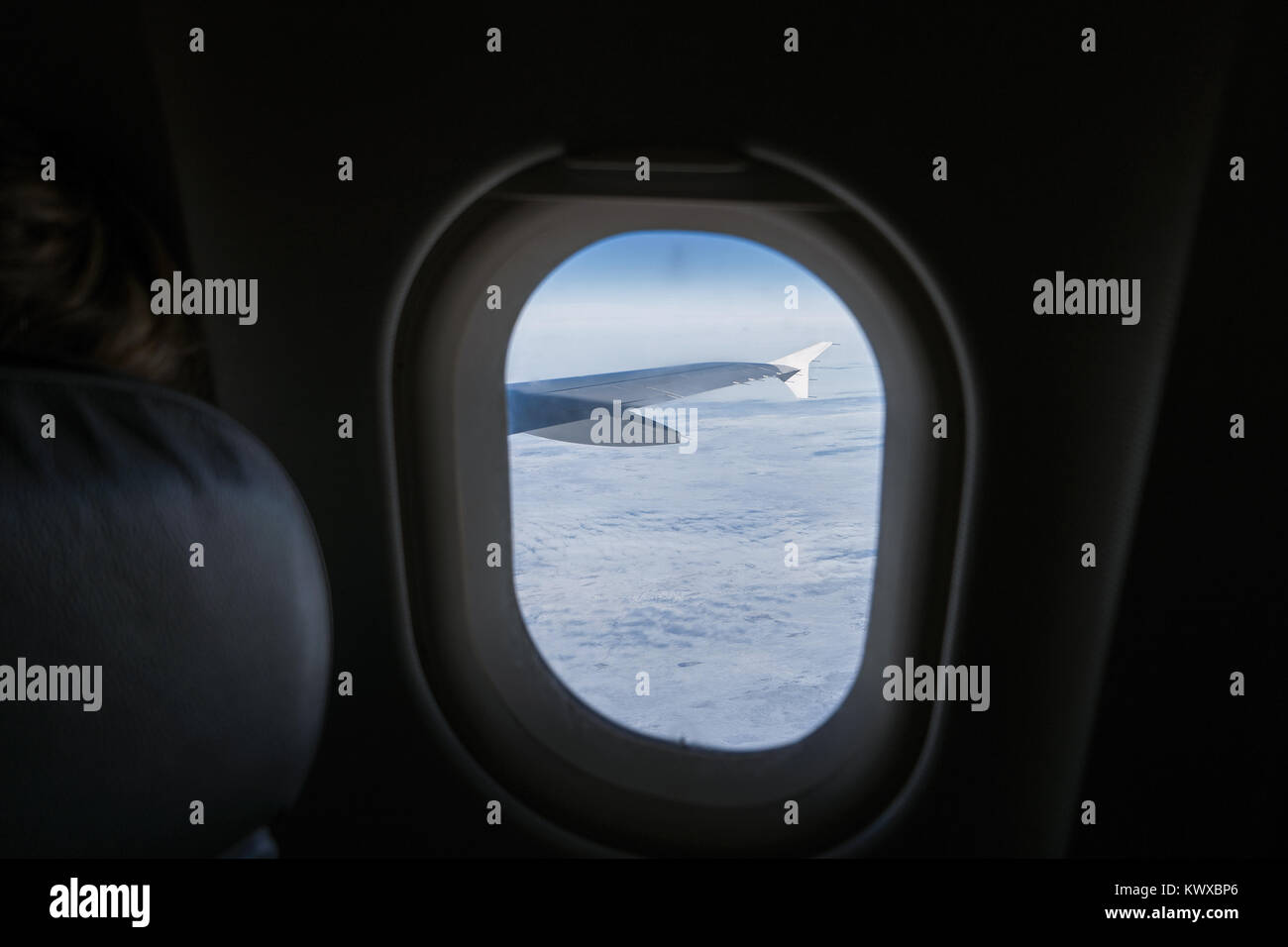Window of airliner with sky and wing Stock Photo - Alamy
