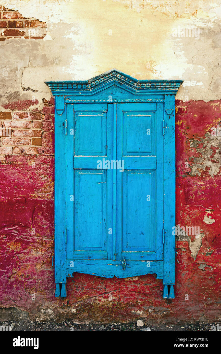 Blue color window of a old abandoned house in Russia with obsolete ...