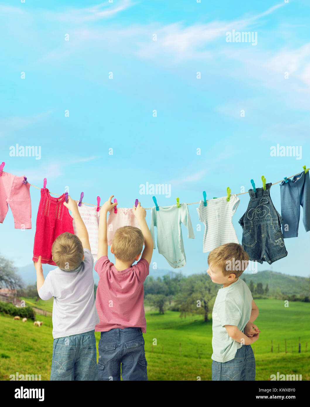 Cute little kids doing the laundry Stock Photo - Alamy