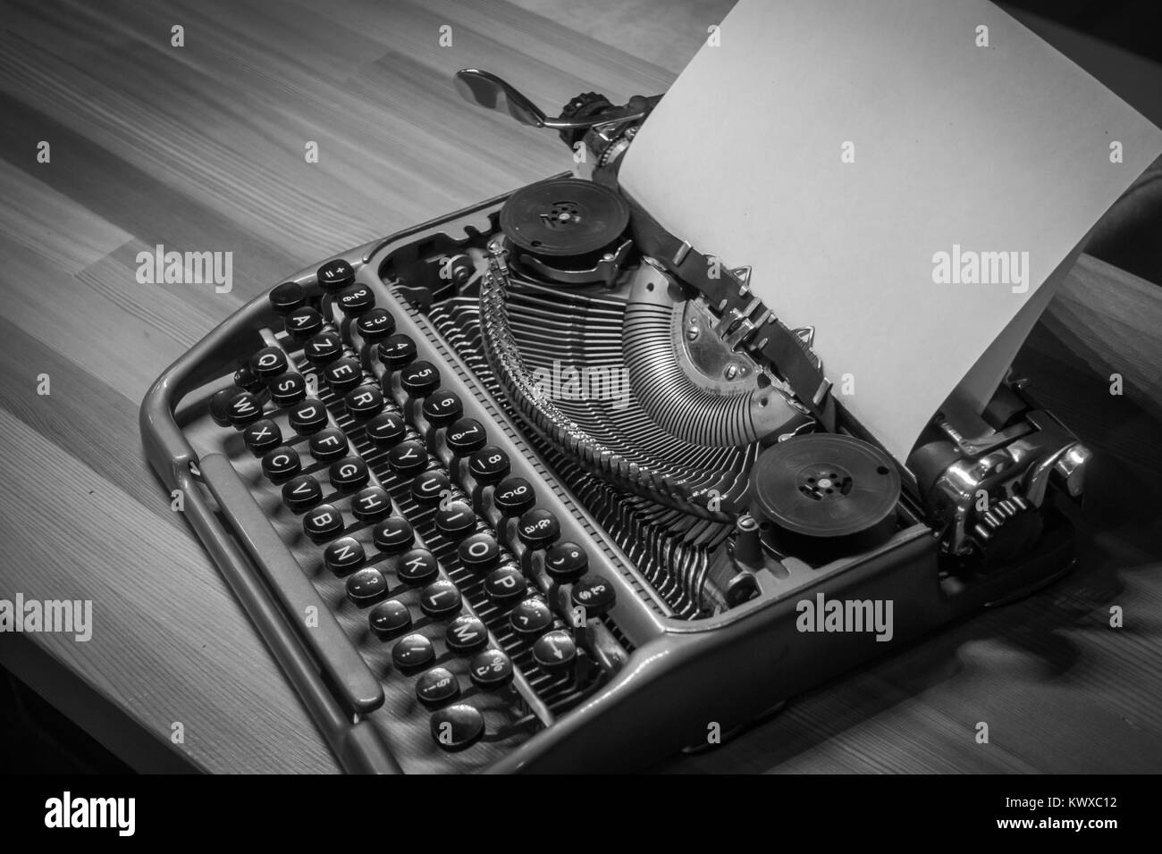 Typewriter ready for use with blank paper installed Stock Photo - Alamy