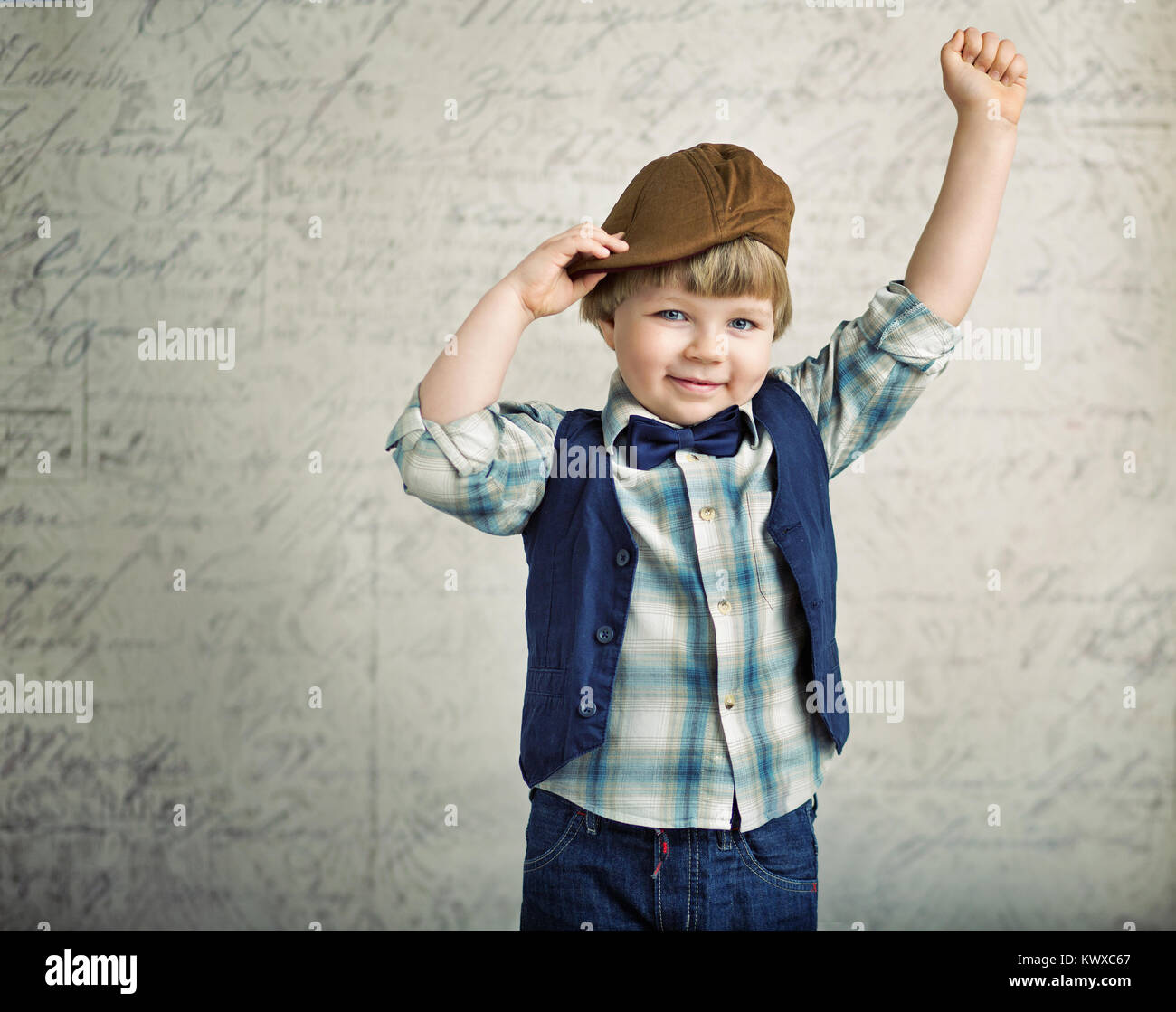 Handsome little boy with a wining gesture Stock Photo - Alamy