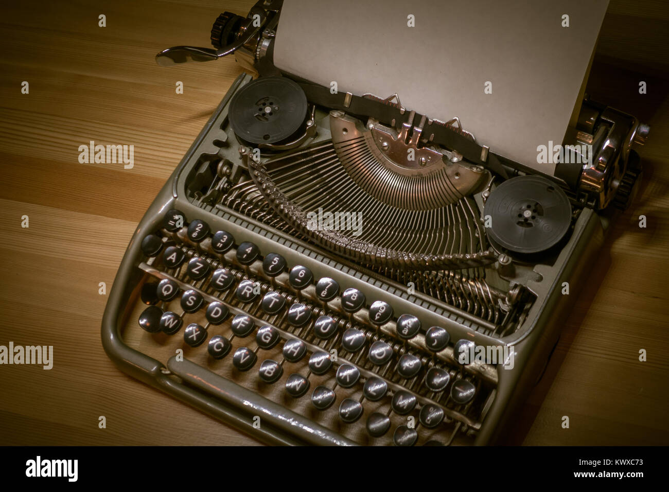 Typewriter ready for use with blank paper installed Stock Photo - Alamy