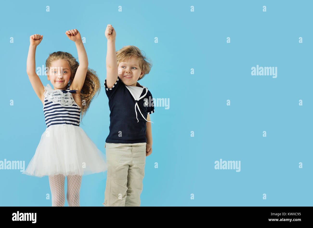 Portrait of cute jumping children Stock Photo - Alamy
