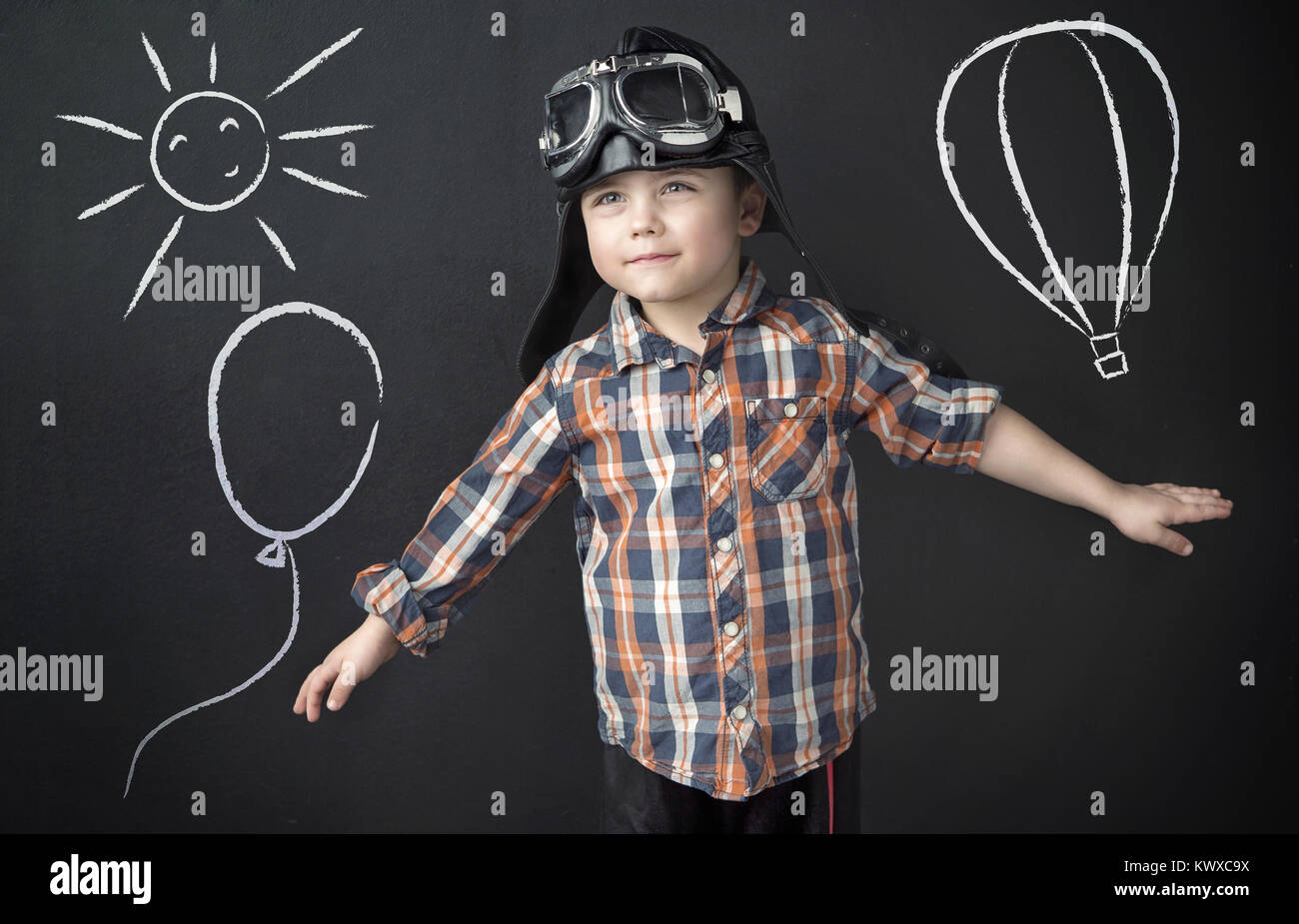 Small clever man as a pilot Stock Photo - Alamy