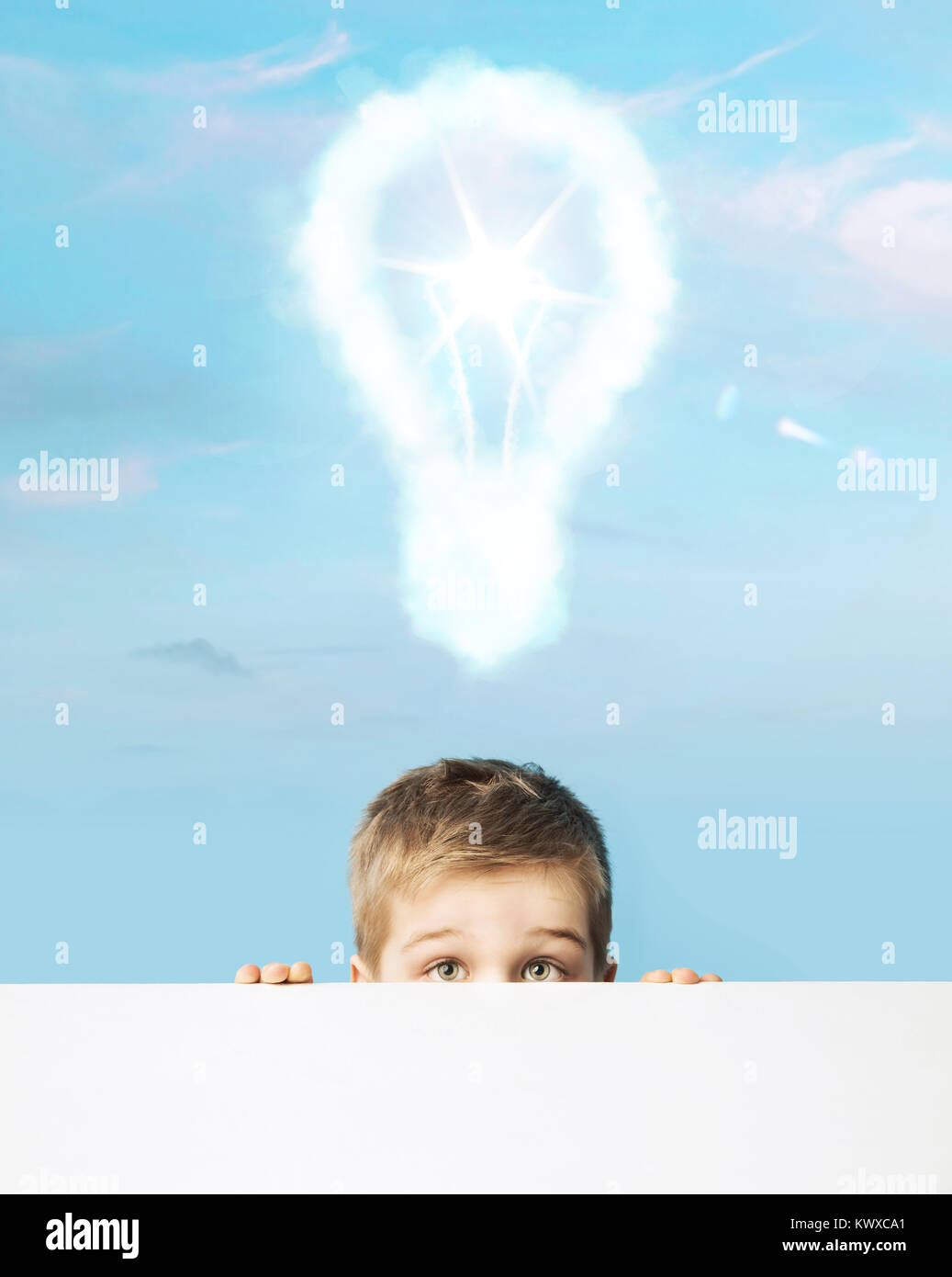 Little boy with a light bulb above head Stock Photo - Alamy