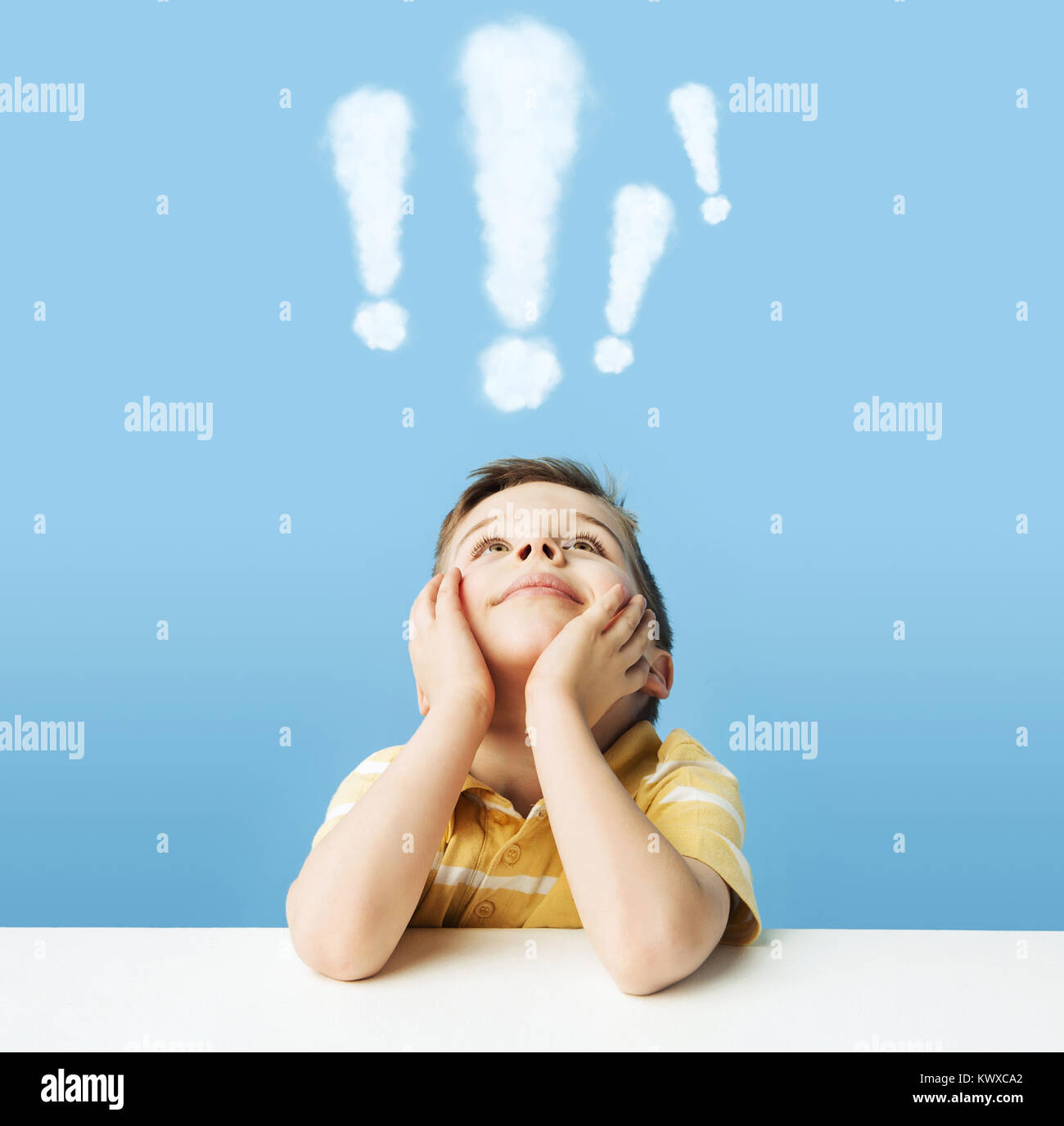 Little boy with exclamation marks above head Stock Photo - Alamy
