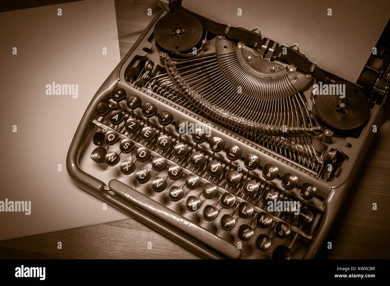 Typewriter ready for use with blank paper installed Stock Photo - Alamy
