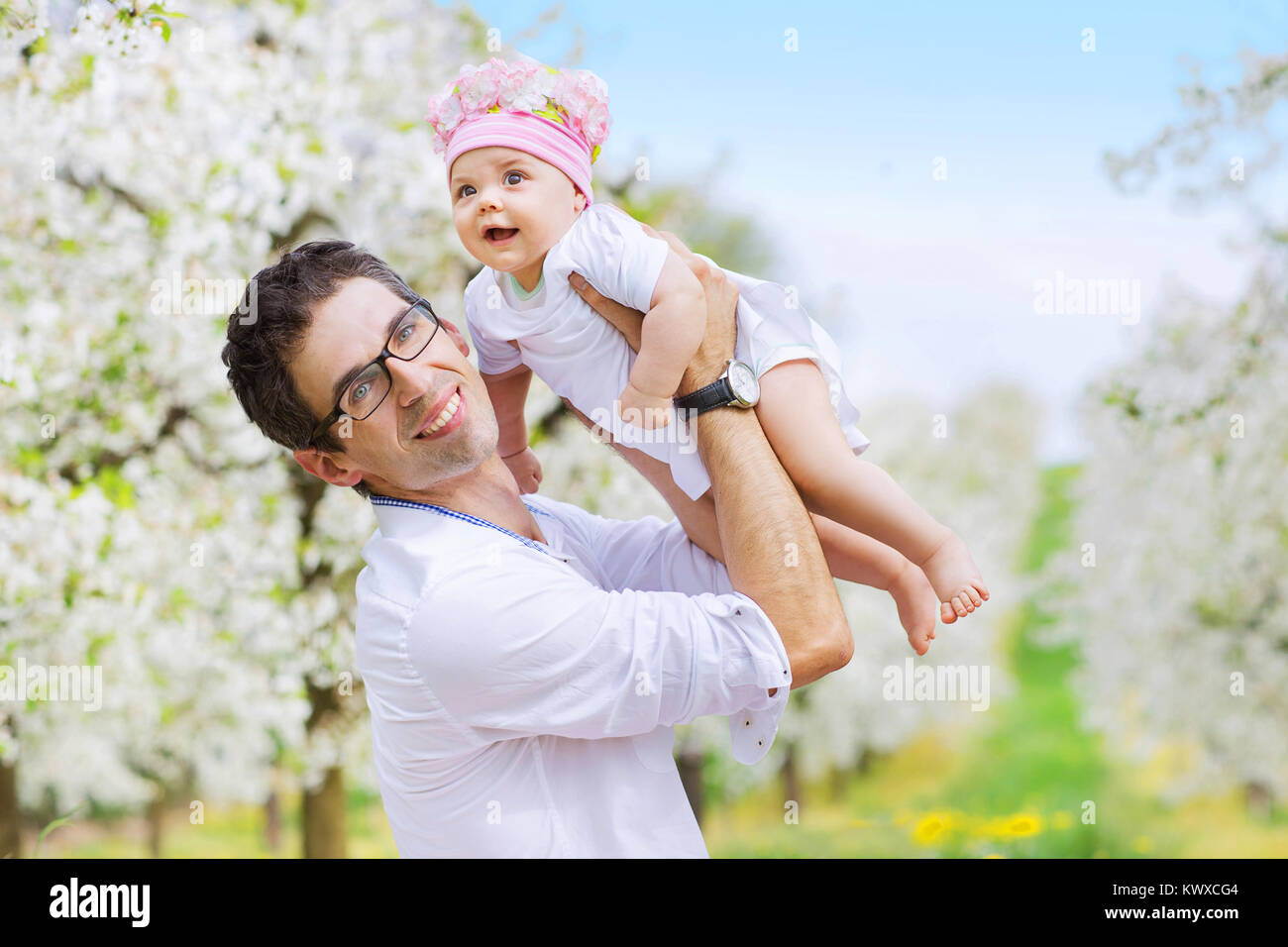 Cheerful man holding his beloved child Stock Photo - Alamy