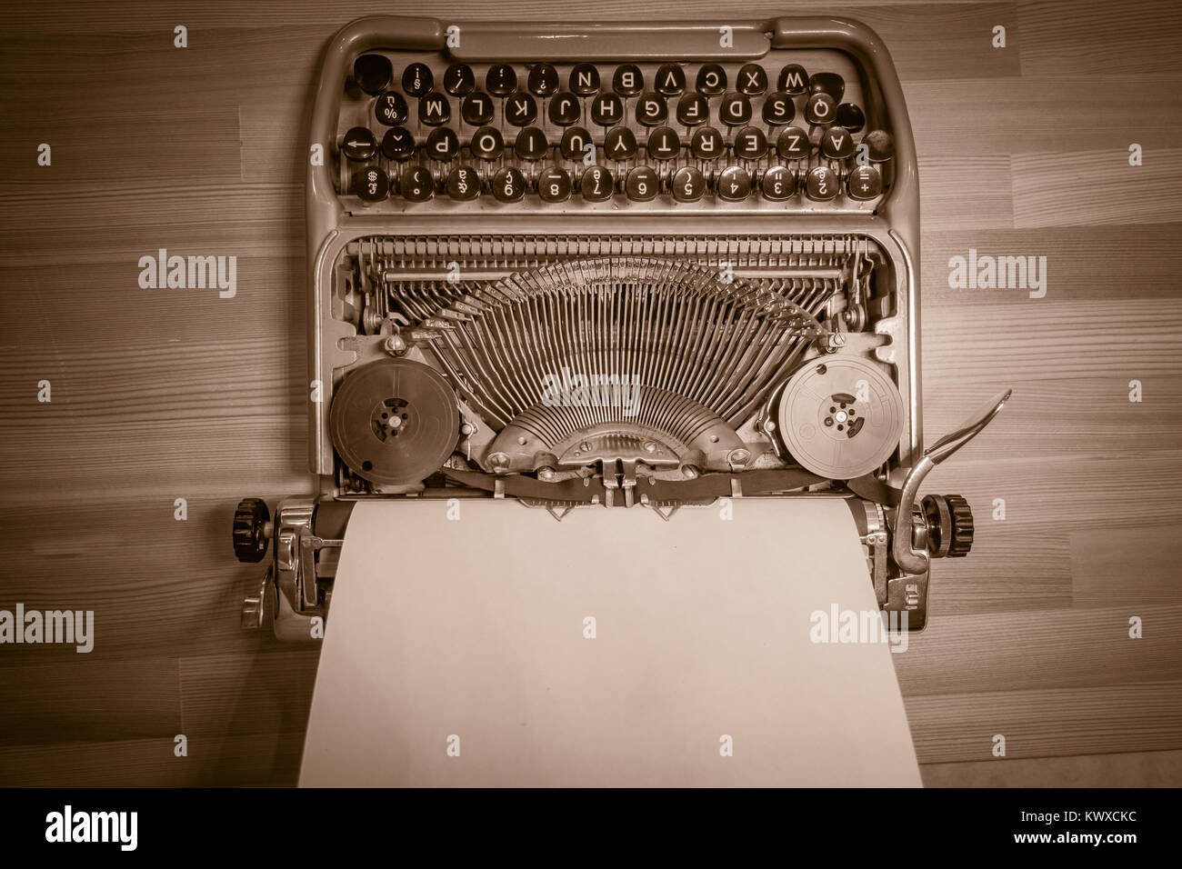 Typewriter ready for use with blank paper installed Stock Photo - Alamy