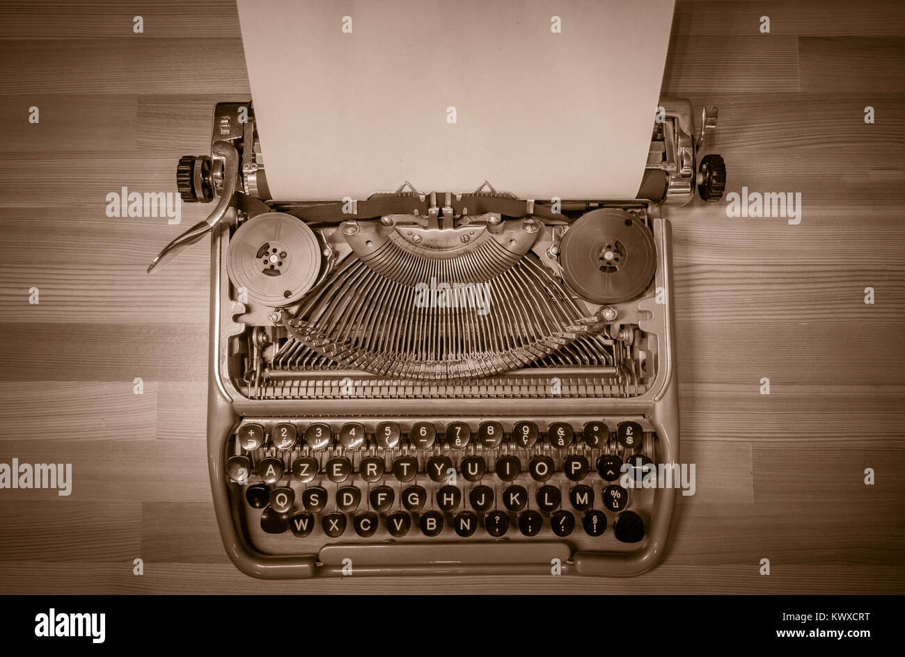 Typewriter ready for use with blank paper installed Stock Photo - Alamy