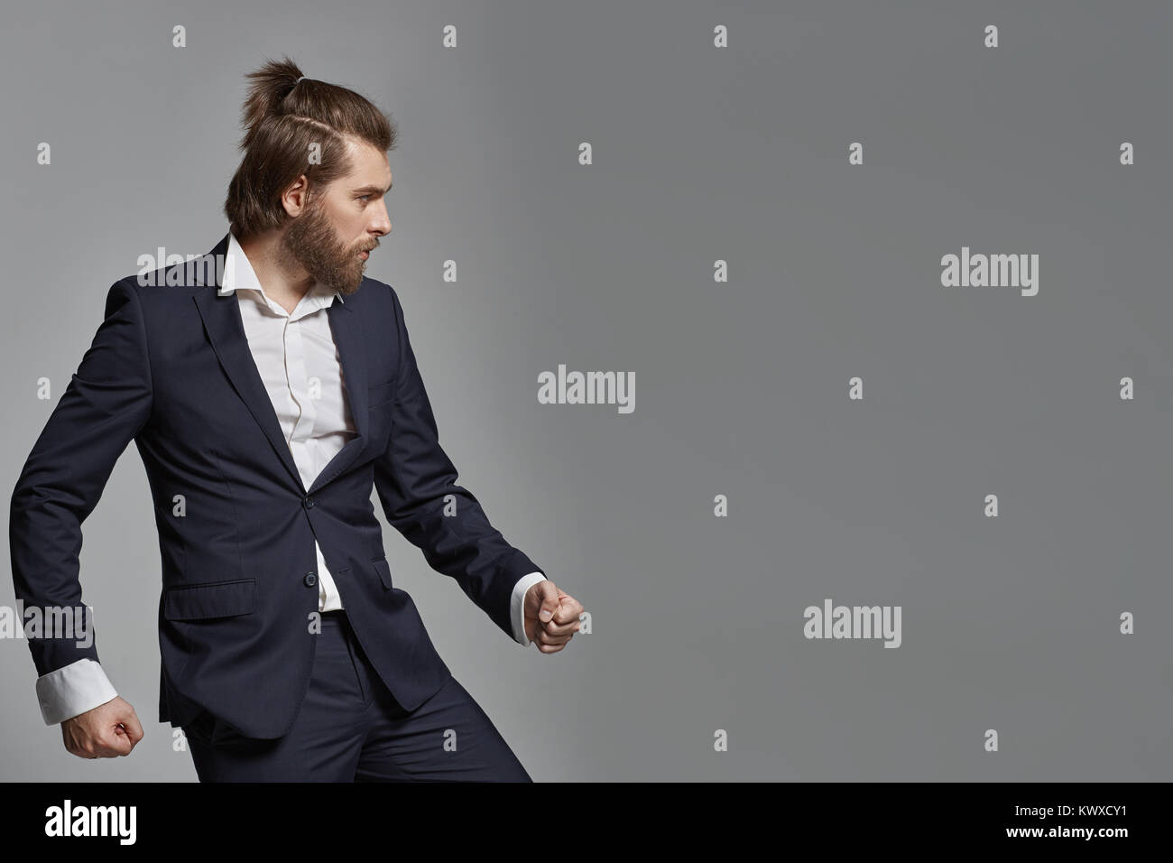 Stylish man with beard wearing suit Stock Photo - Alamy