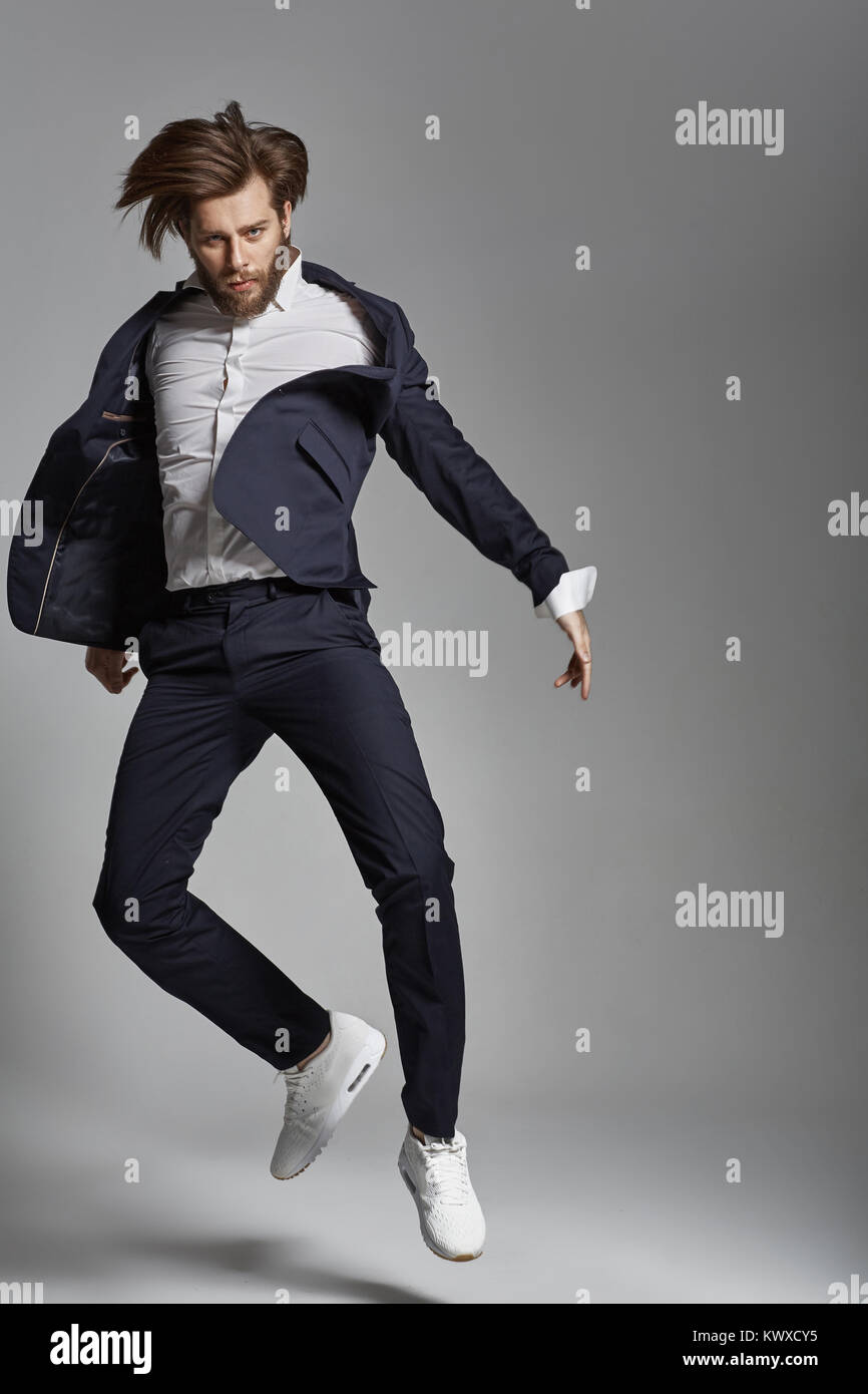 Portrait of the jumping flexible man Stock Photo - Alamy