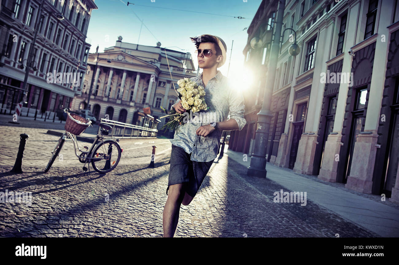 Handsome man looking for his lovely girlfriend Stock Photo - Alamy