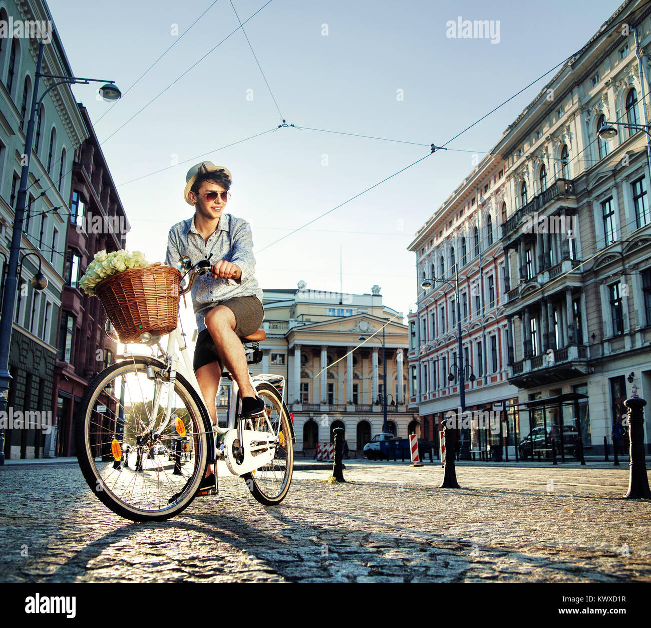 Young elegant man riding a bicycle Stock Photo - Alamy