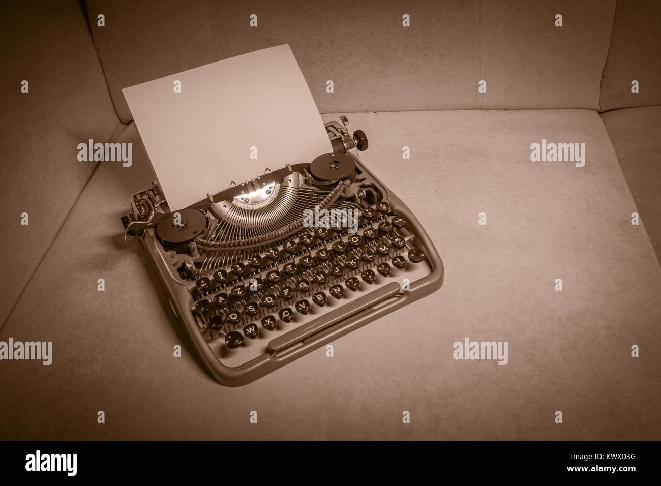 Typewriter ready for use with blank paper installed Stock Photo - Alamy