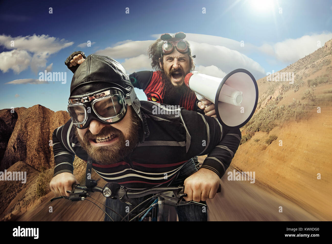 Funny portrait of a tandem of bicyclists Stock Photo - Alamy