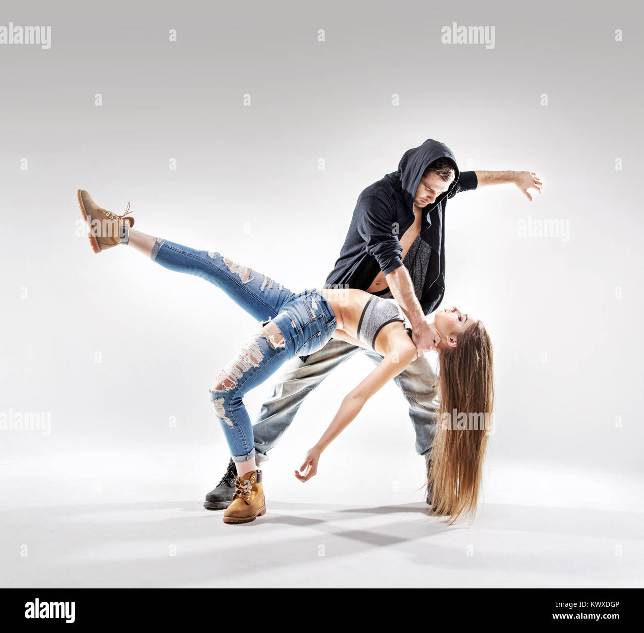 Acrobat pose of a two talented, young dancers Stock Photo - Alamy