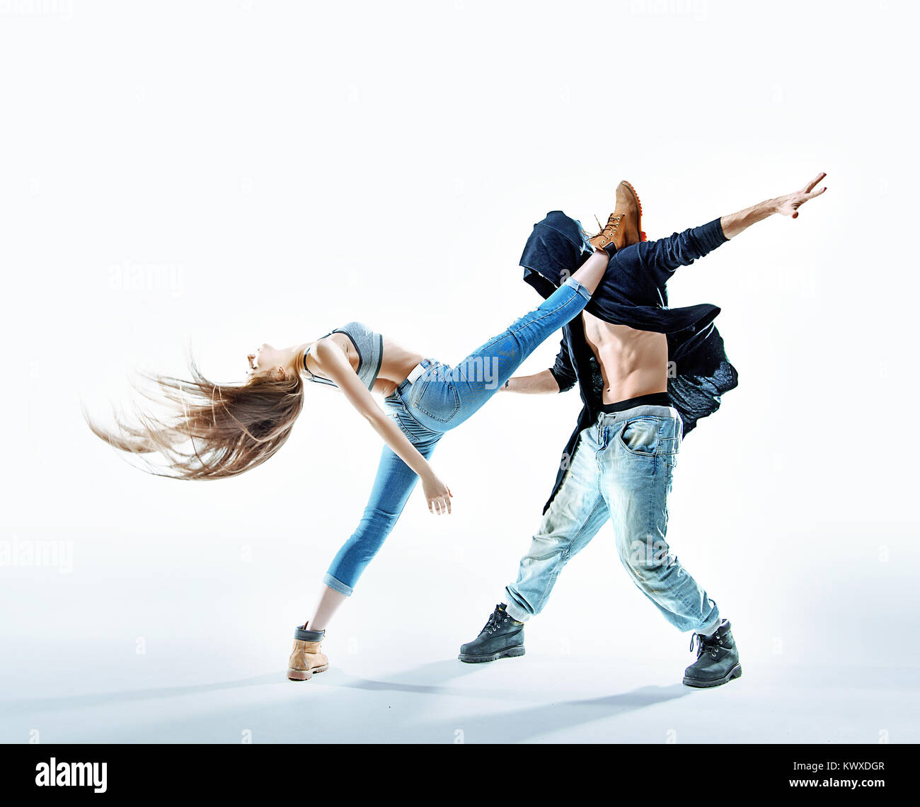 Two athletic young dancers making a performance Stock Photo - Alamy