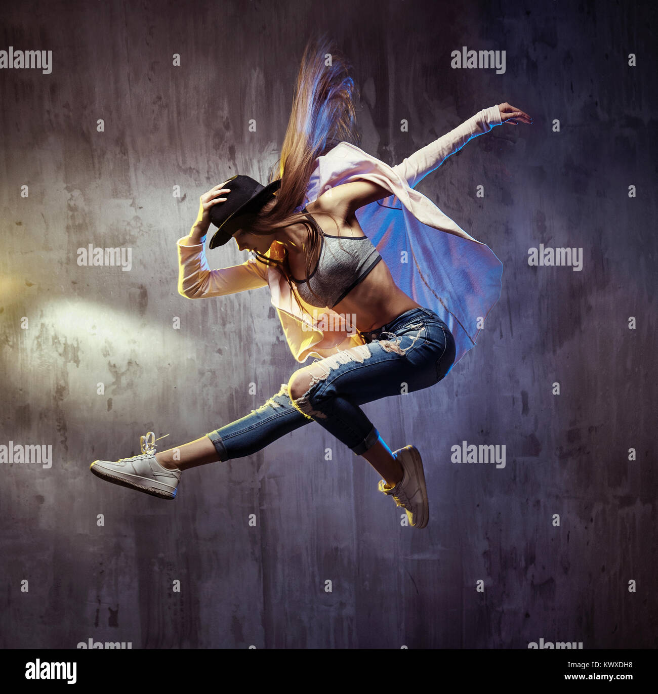 Fit young hip hop dancer during the performance Stock Photo - Alamy