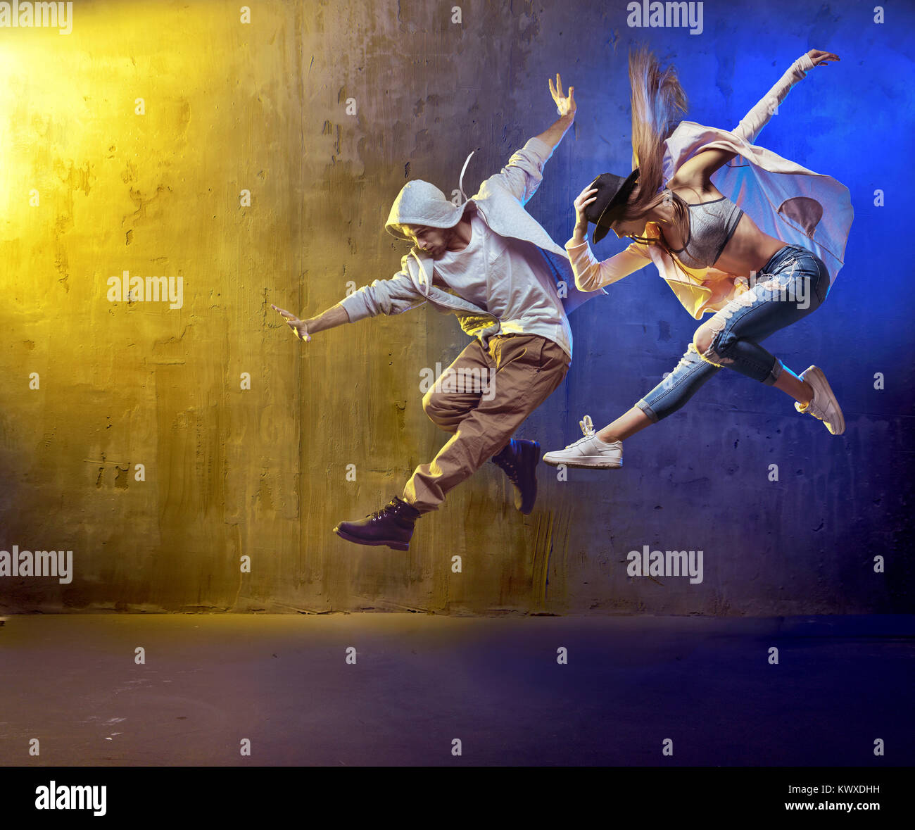 Stylish dancers fancing in a concrete place Stock Photo - Alamy