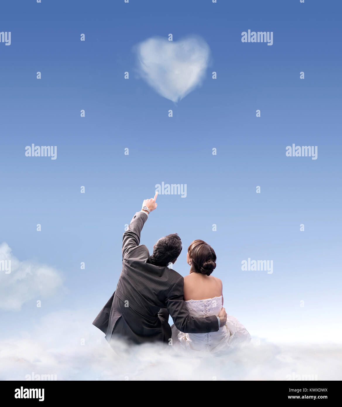 Young married couple touching the pure sky Stock Photo - Alamy