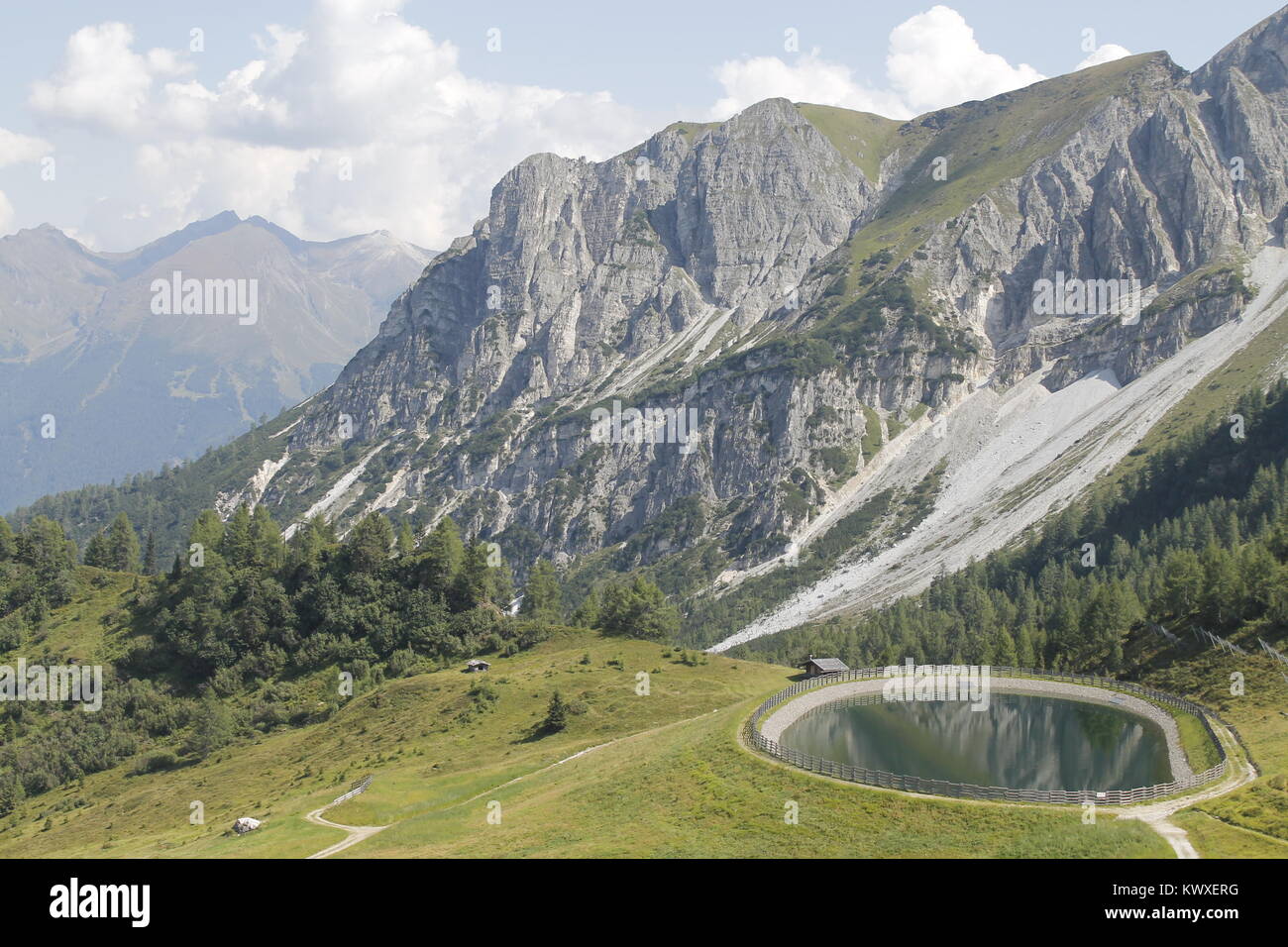 small alpine lake in the high mountains Stock Photo - Alamy