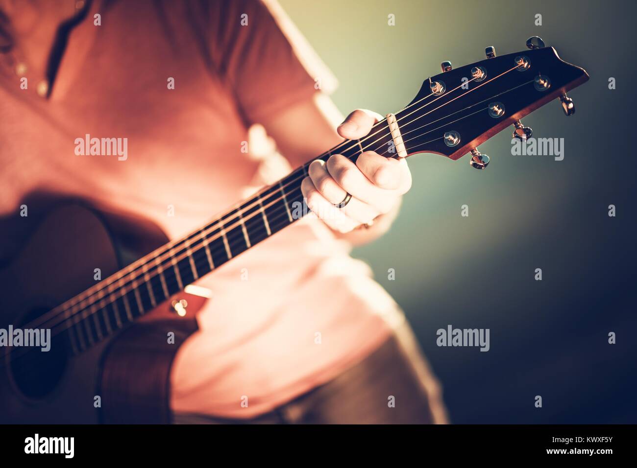 Guitar Neck Handling Closeup Photo. Musician Playing Acoustic Guitar ...