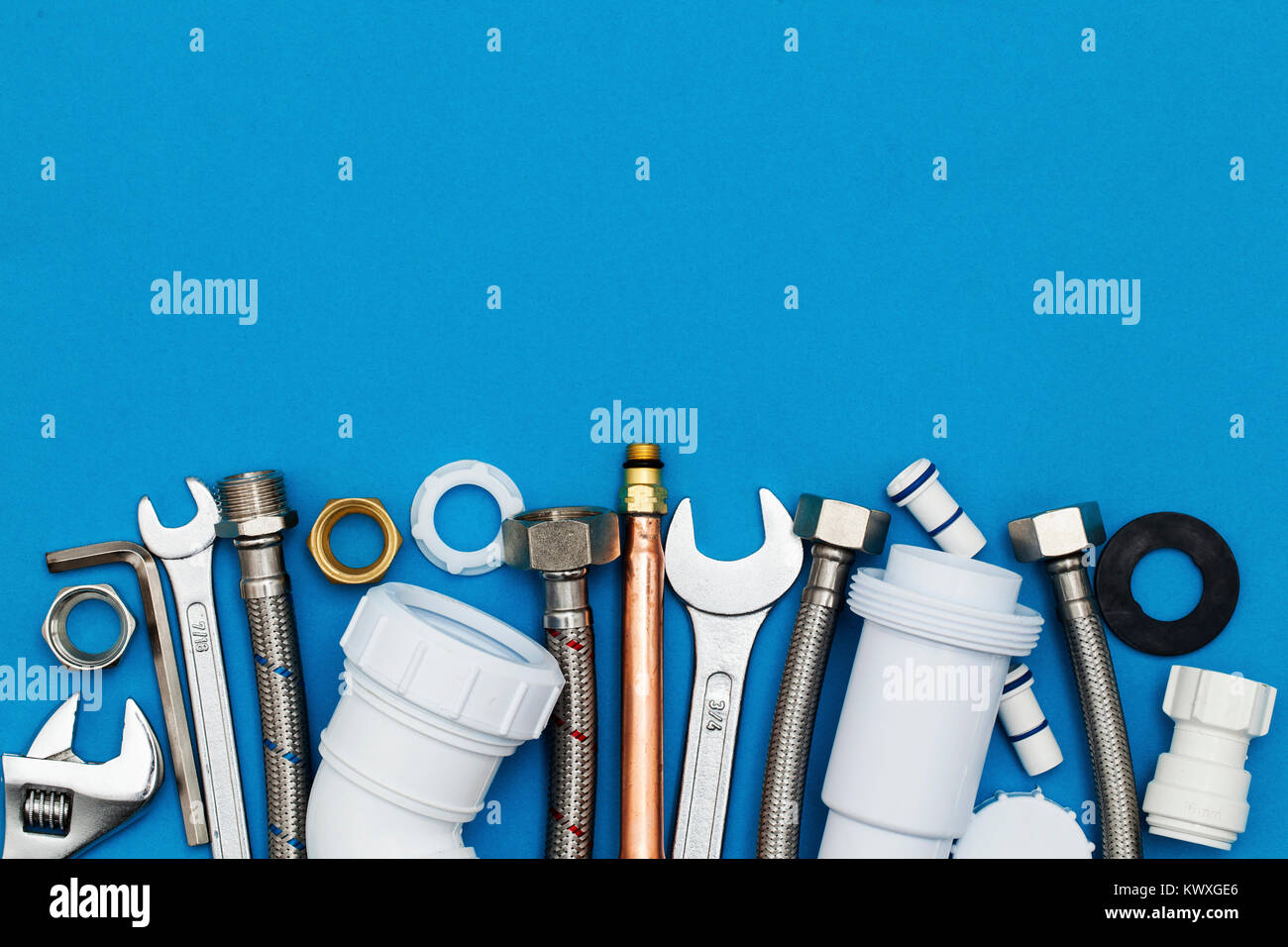 Plumbing tools and equipment overhead view on a blue background Stock ...