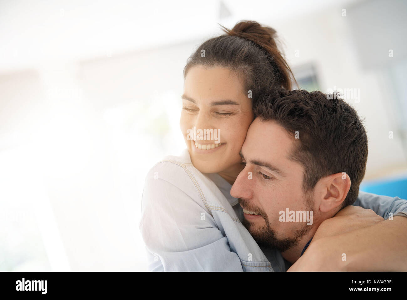 Cheerful romantic couple of lovers cuddling Stock Photo - Alamy