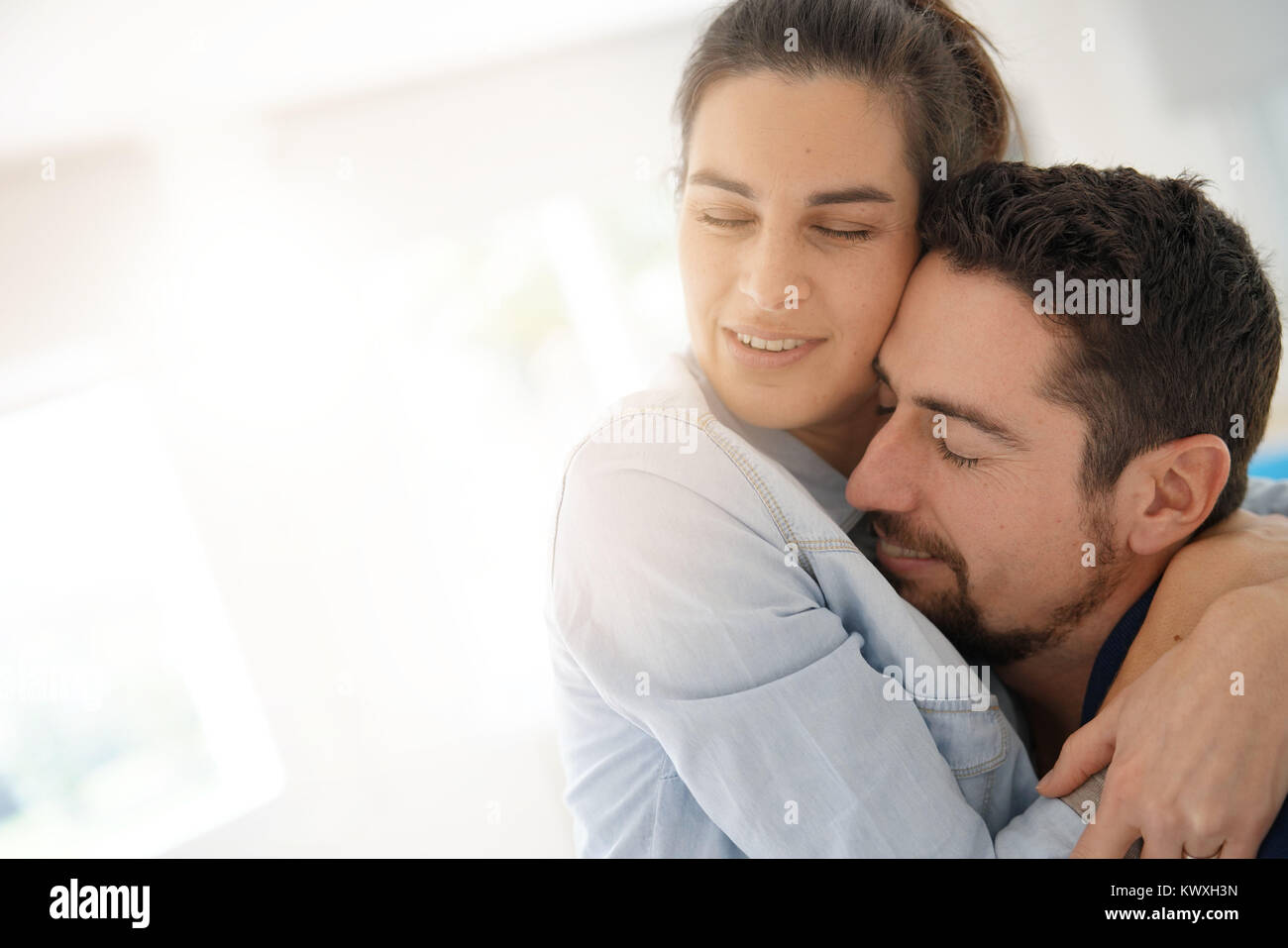 Cheerful romantic couple of lovers cuddling Stock Photo - Alamy