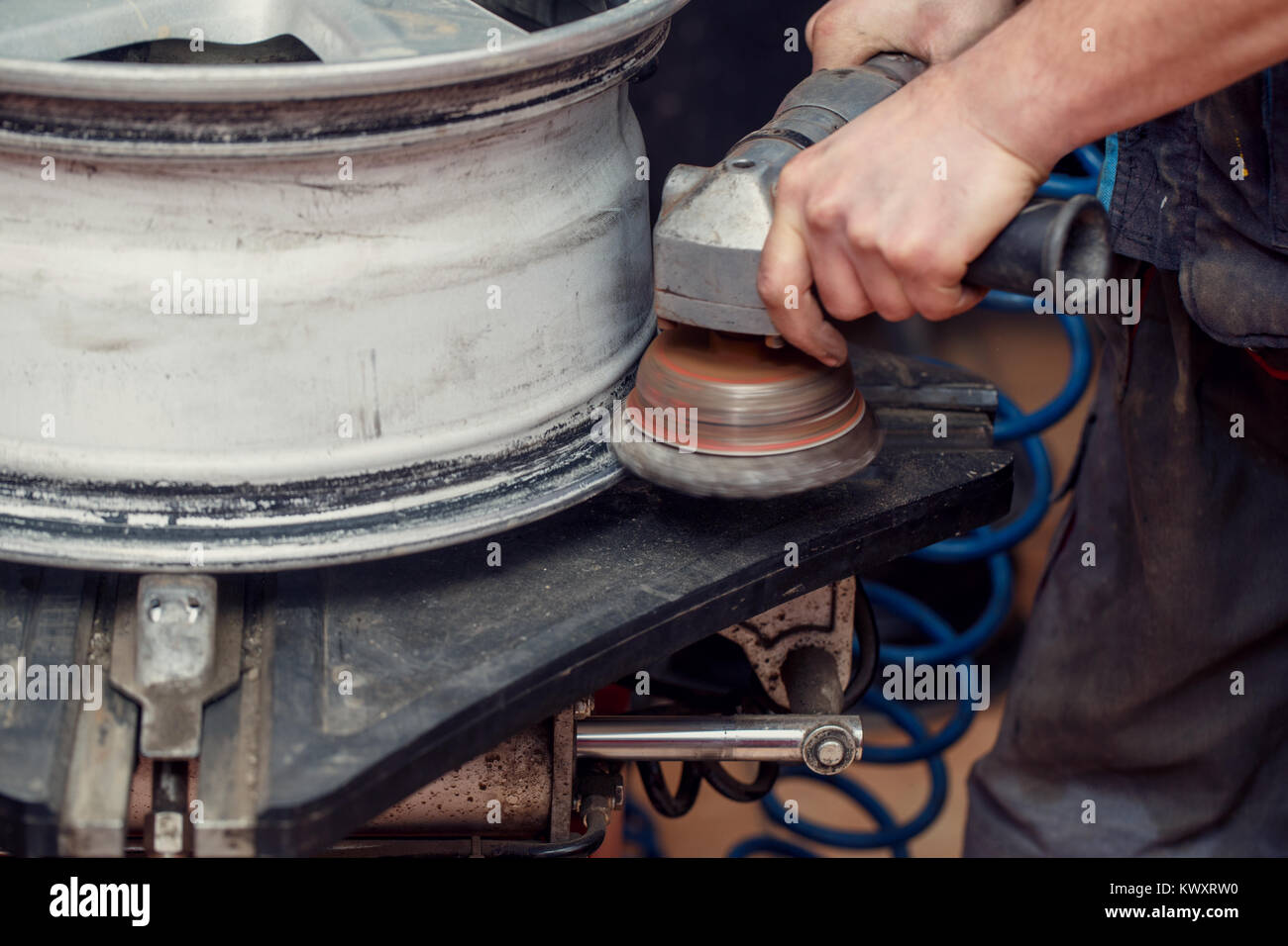 Male worker using grinder machine hi-res stock photography and images ...