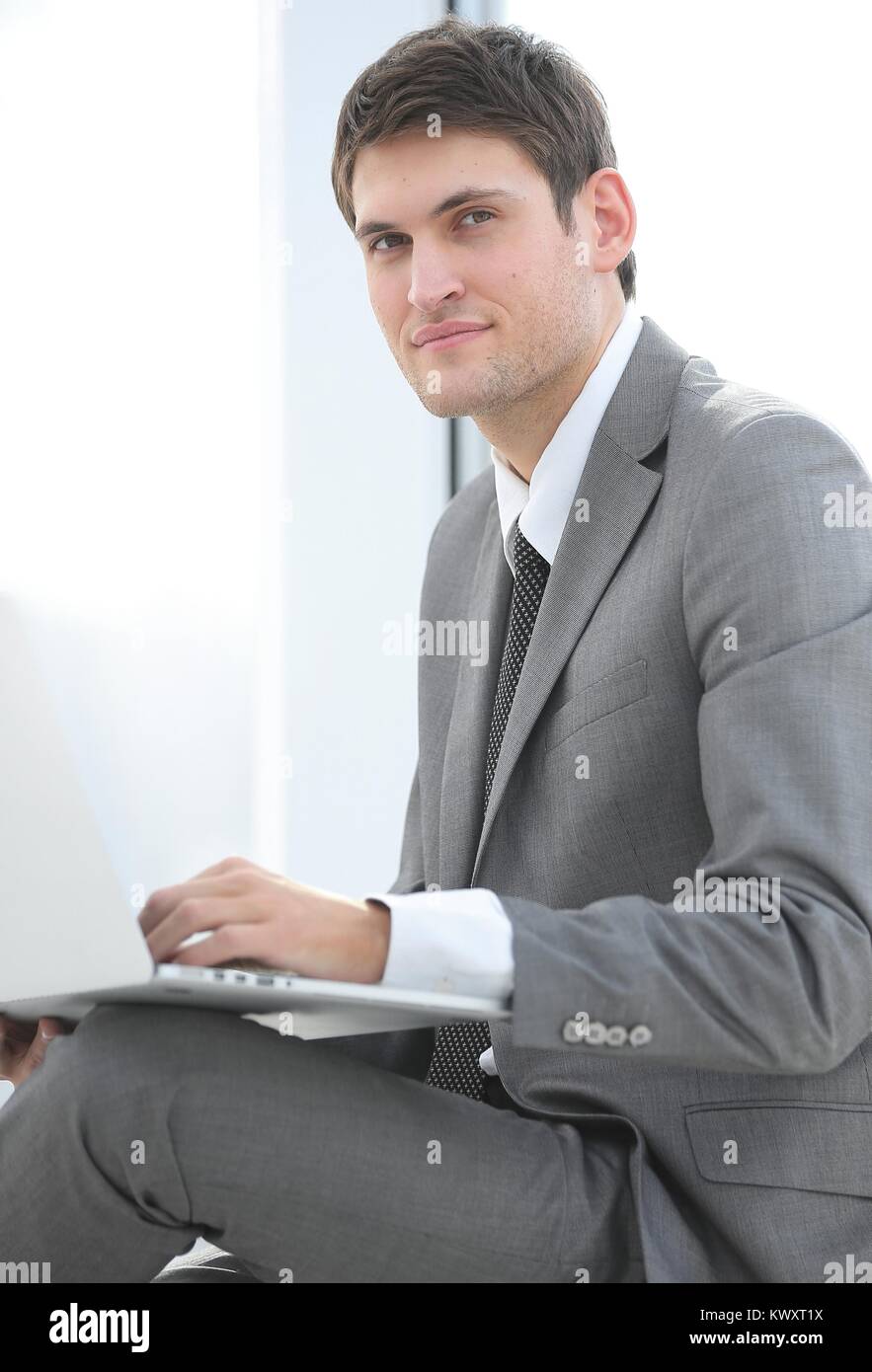 employee communicates on the Internet via laptop Stock Photo - Alamy