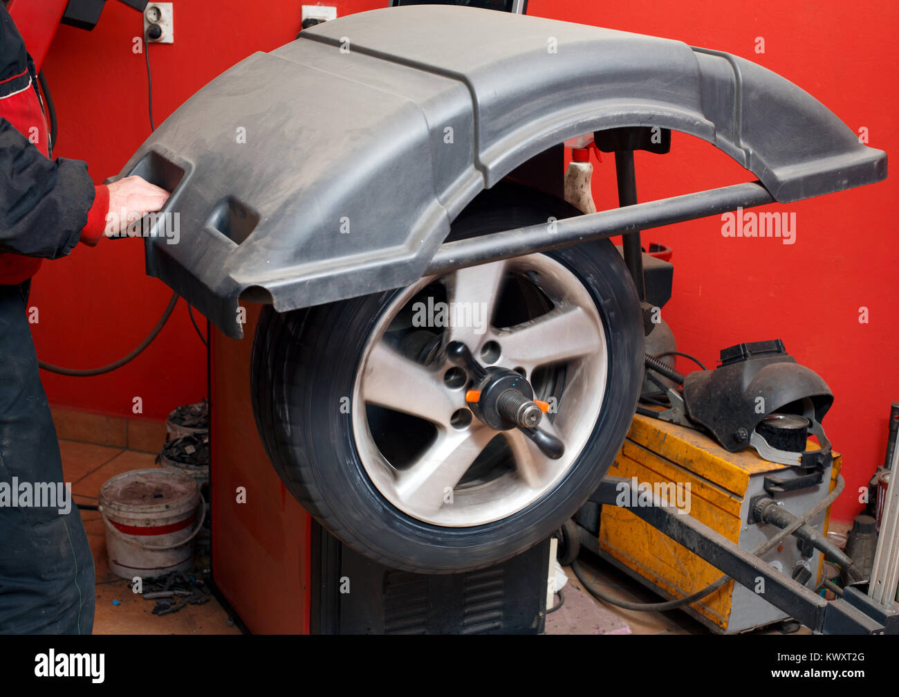 Mechanic balancing wheel machine balancer hi-res stock photography and ...