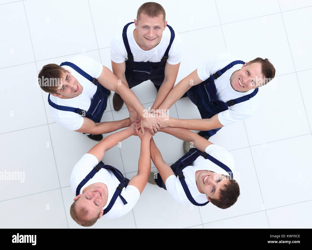 concept of teamwork. architects and builders standing in a circle Stock ...