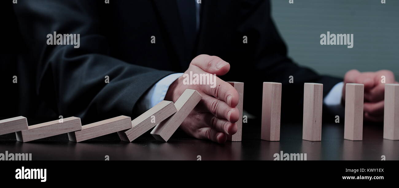 male hand placing wooden block on a tower. planing and strategy concept ...