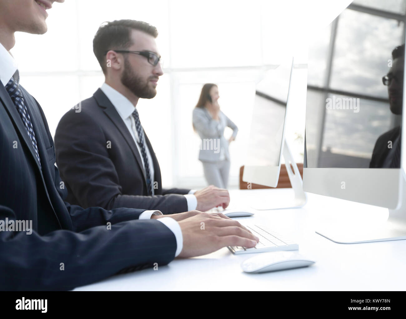 employees working on computers.photos on blurred background Stock Photo ...
