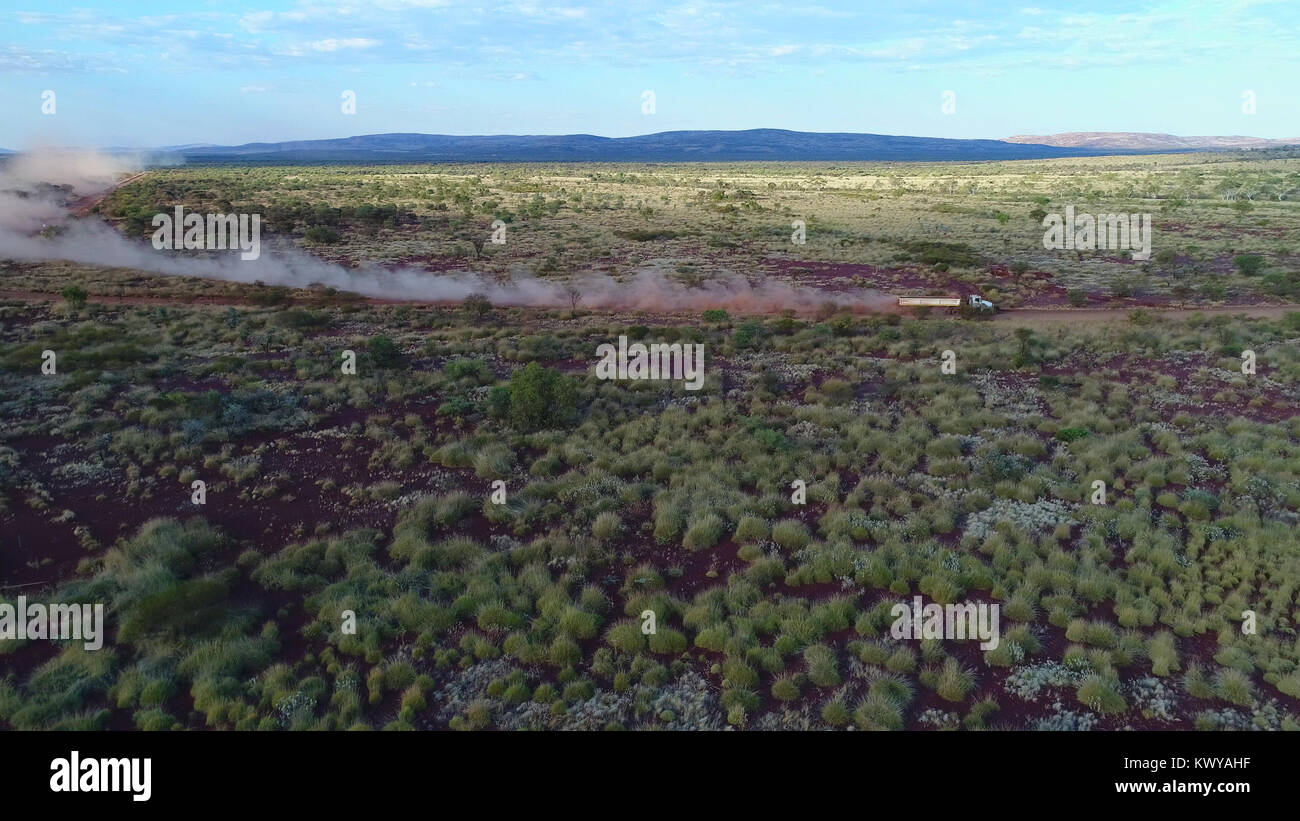 Truck travelling on a dirt road in the Australian outback, Pilbara ...