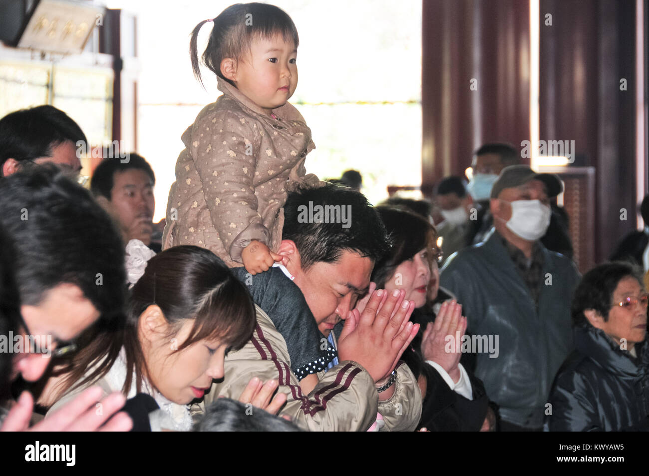 Tokyo, Japan - March 15, 2009: People praying at the Shinto Asakusa ...
