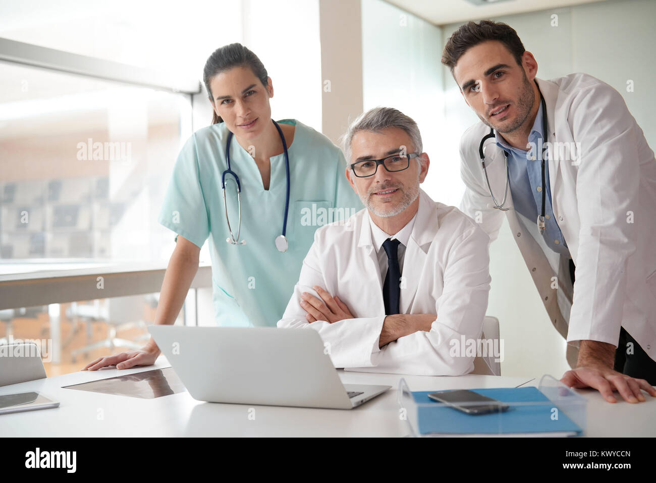 Portrait of medical people standing in hospital room Stock Photo - Alamy