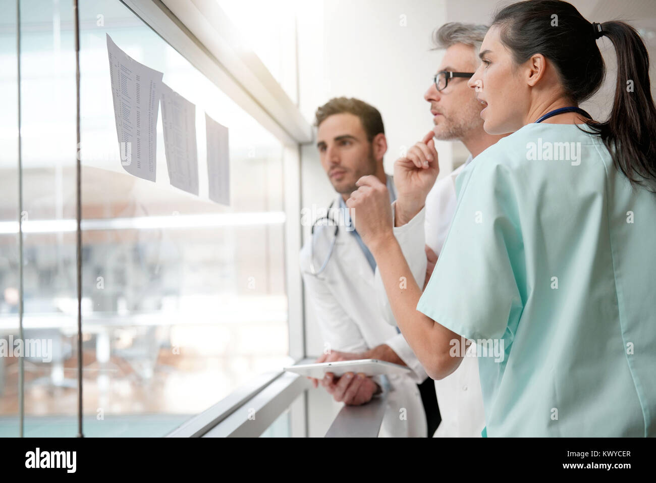 Medical team meeting to talk about medical reports Stock Photo - Alamy