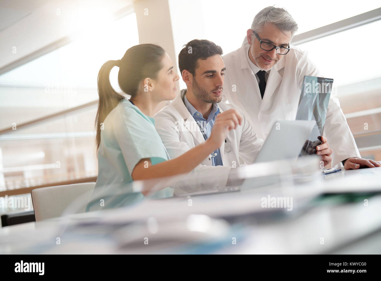 Medical team checking Xray results Stock Photo - Alamy